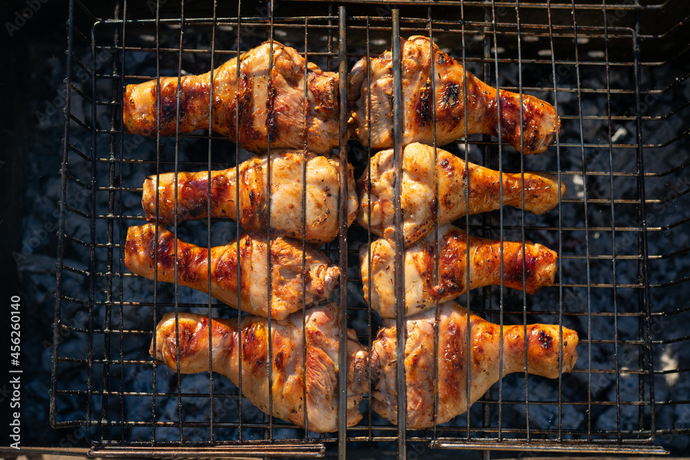 Grilled chicken meat, chicken legs on grill grid. BBQ chicken top view ...