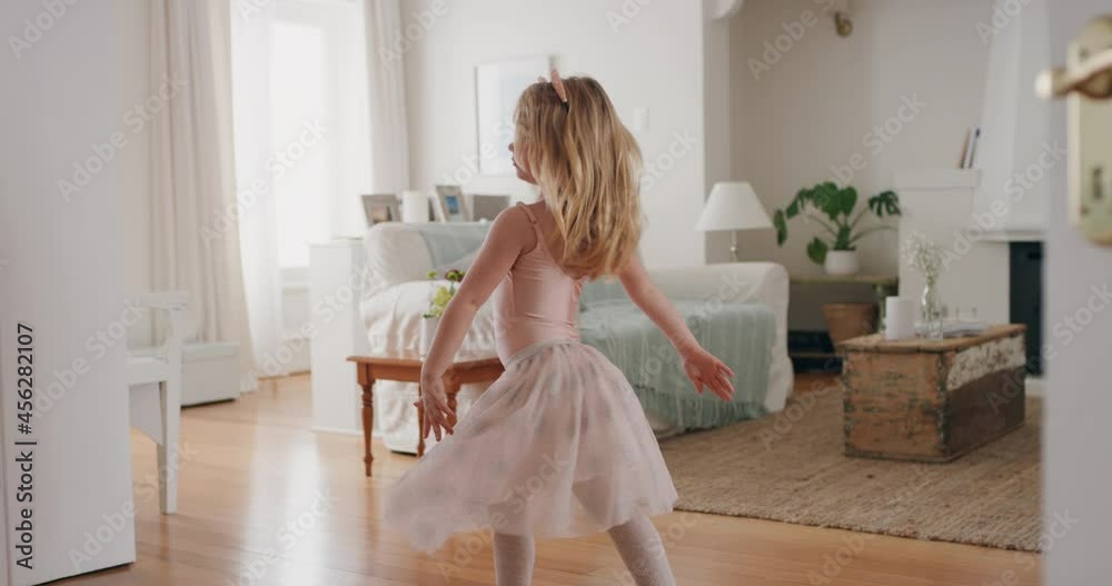 cute little girl dancing playfully pretending to be ballerina happy ...
