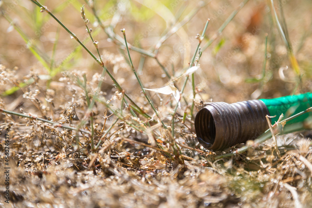 Slowly dripping garden hose pipe lying in dry weeds Stock Photo | Adobe ...