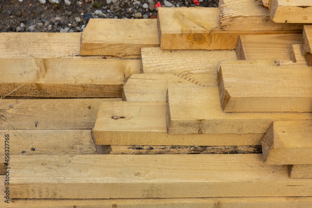 Stacked lumber. Folded wood.Closeup wooden boards.The surface of the ...