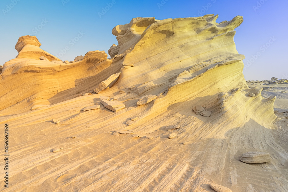 Weathered and battered by wind direction these rock formations are ...