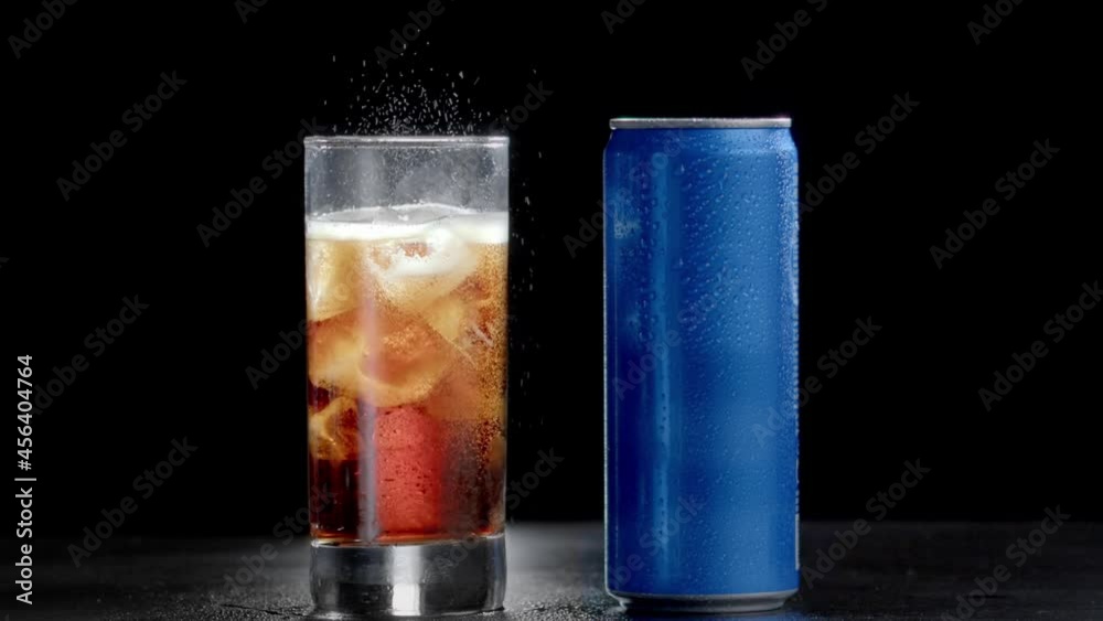 Cola with bubbles and ice cubes close-up. Cola with Ice and bubbles in ...