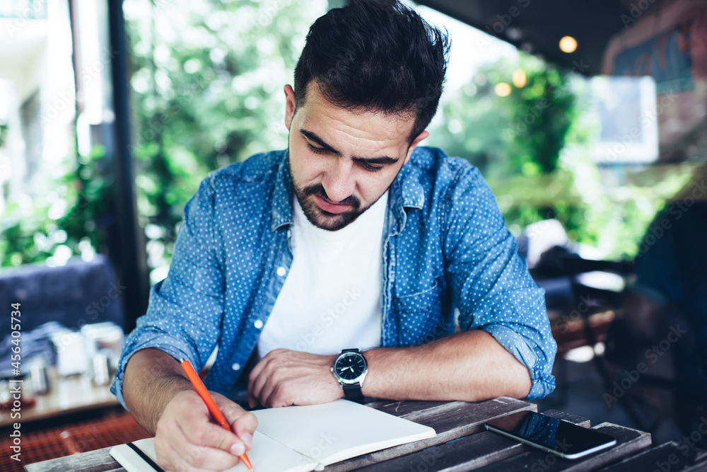 Caucasian male student with education textbook for planning ...