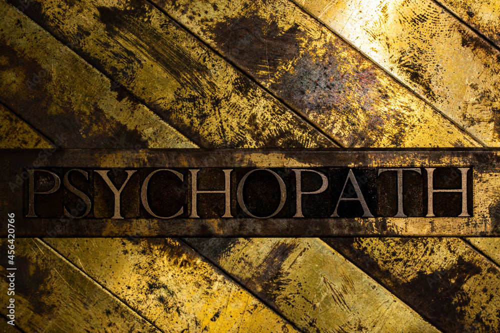 Psychopath text on vintage textured copper and gold background Stock ...