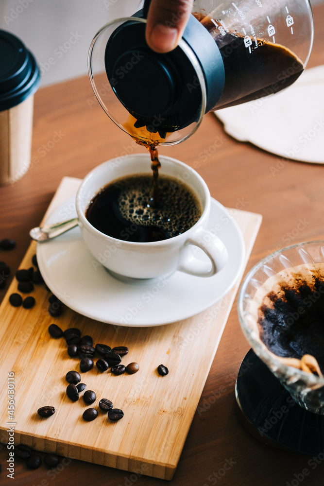 Man pouring coffee in a cup, alternative coffee brewing method, using ...