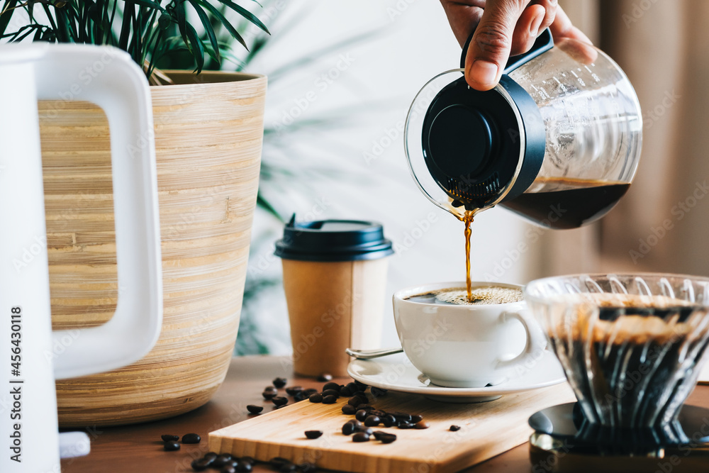 Man pouring coffee in a cup, alternative coffee brewing method, using ...