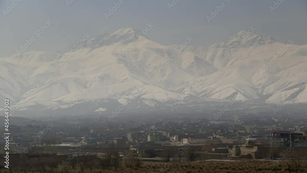 Afghanistan scene - tele photo scene of white snow filled mountains and ...