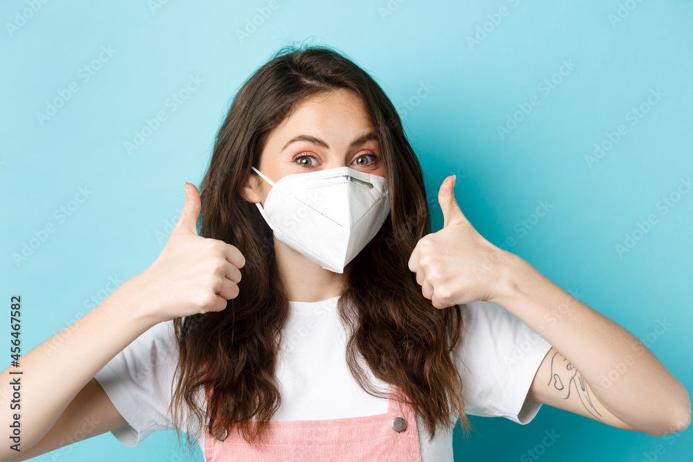 Covid-19, social distancing and lockdown concept. Young woman supports ...