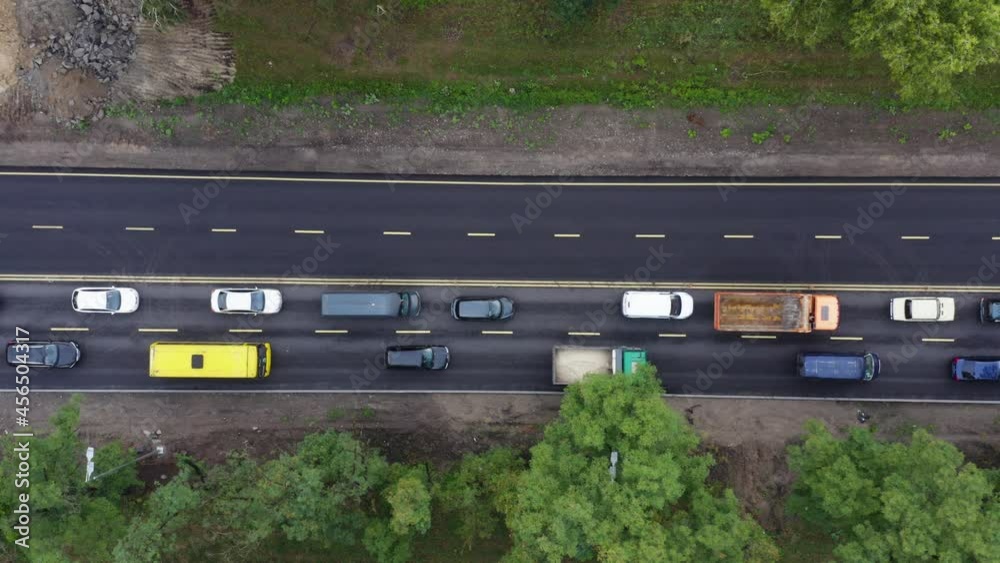 Direct view from above to the road traffic. Traffic jam at a highway ...