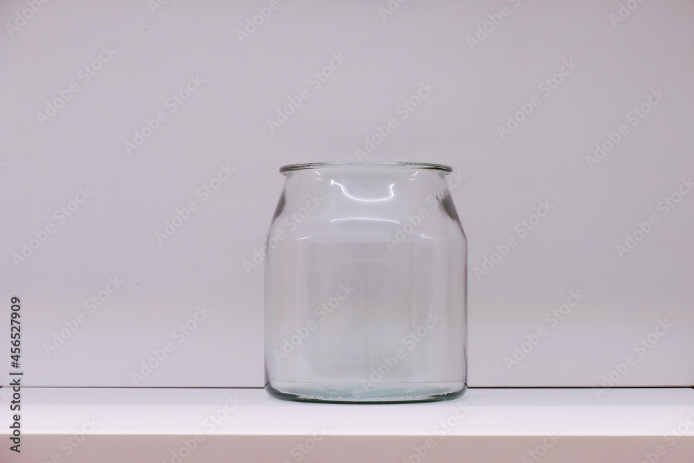 Transparent glass bottle jar against white background for branding mock ...