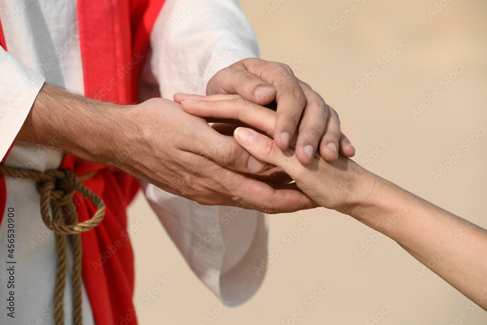 Jesus Christ holding woman's hand in desert, closeup foto de Stock ...