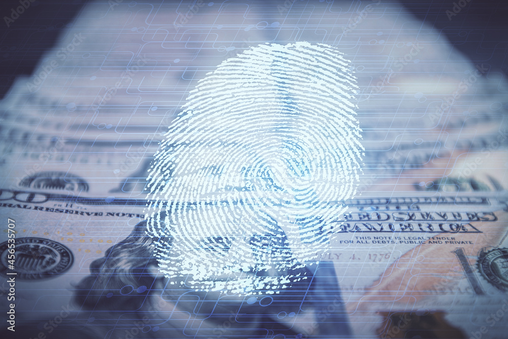 Double exposure of finger print scan drawing over usa dollars bill ...