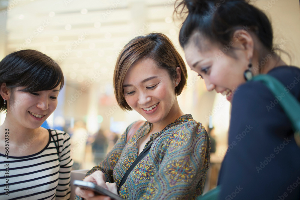 Three young Japanese women talking Stock Photo | Adobe Stock