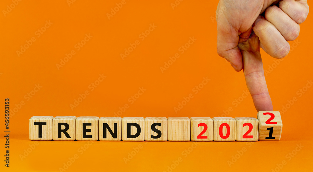2022 trends new year symbol. Businessman turns wooden cubes and changes ...