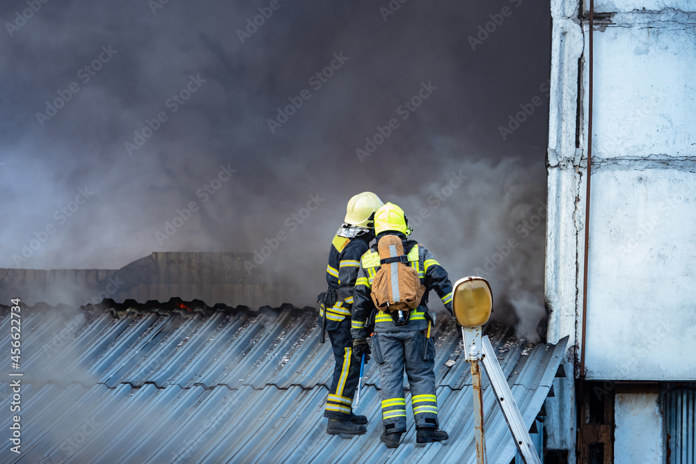 Fire extinguishing. Fire service workers during work. Fight against ...