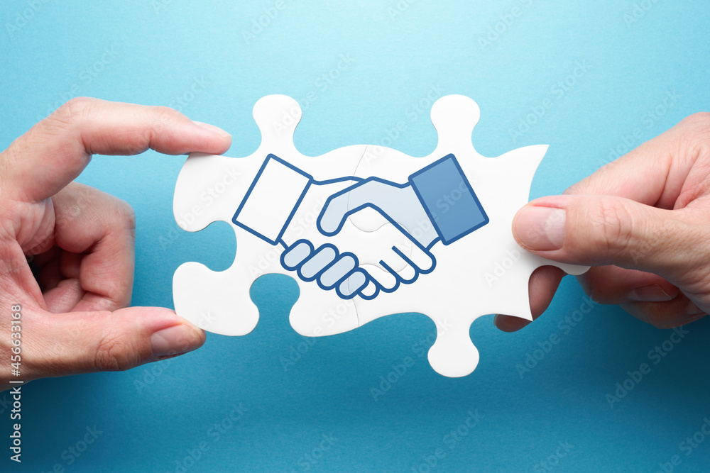 Strategy of business deal. Two hands connecting jigsaw puzzle pieces ...