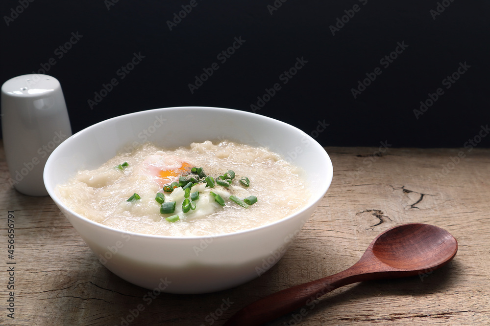 rice porridge with pork and egg or congee is similar to boil rice but ...