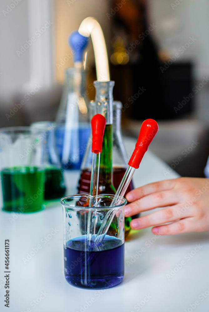 Chemistry laboratory. Conducting a chemical experiment. Experiments in ...