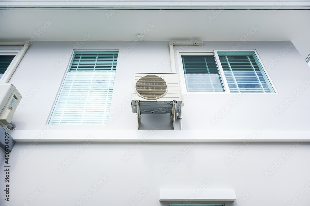 Condenser unit or compressor outside home or residential building. Unit ...