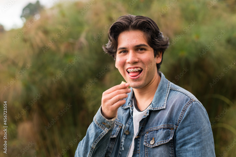 adolescence: happy teenager smiling and showing off their self ...