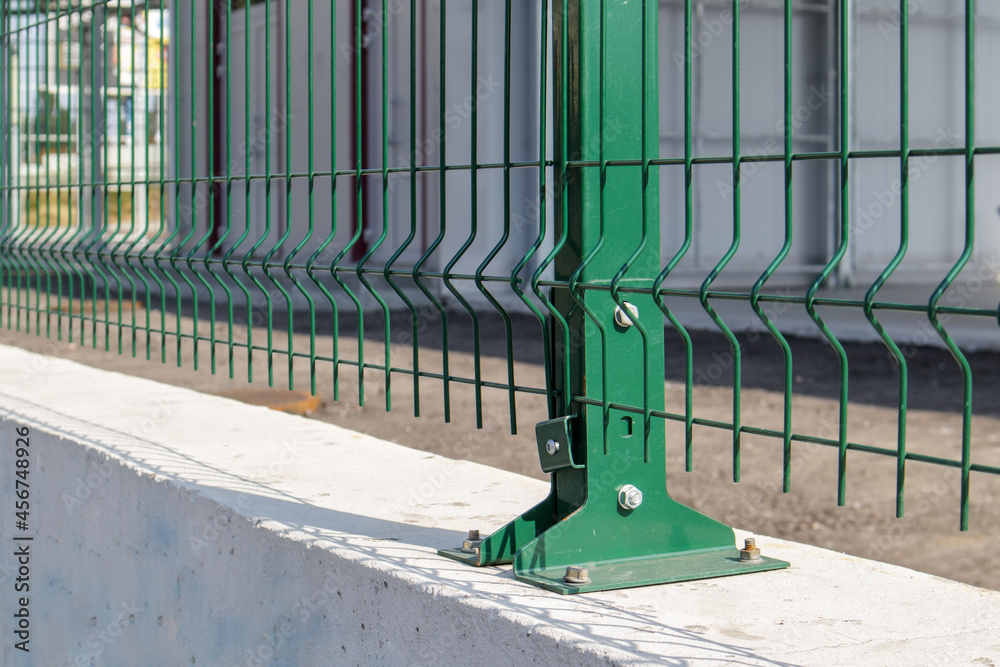 Steel lattice green fence with wire. Fencing. Grid industrial wire ...