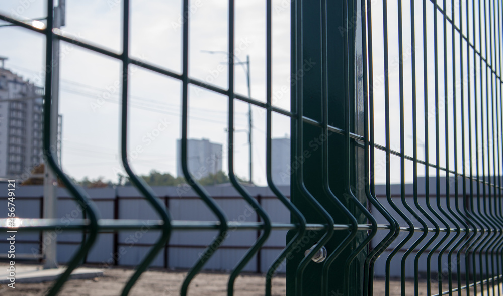 Steel lattice green fence with wire. Fencing. Grid industrial wire ...