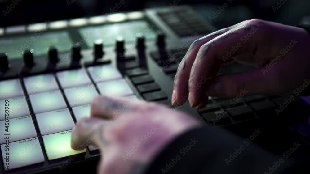 Close up of dj working with the professional drum machine at the night ...