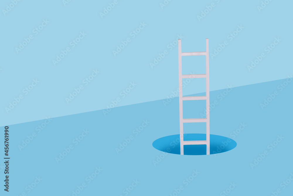 Ladder come out of the hole from underground with copy space. Stock ...