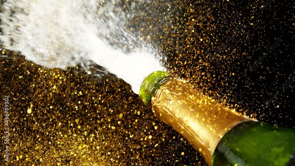 Super slow motion of Champagne explosion with glittering particles ...
