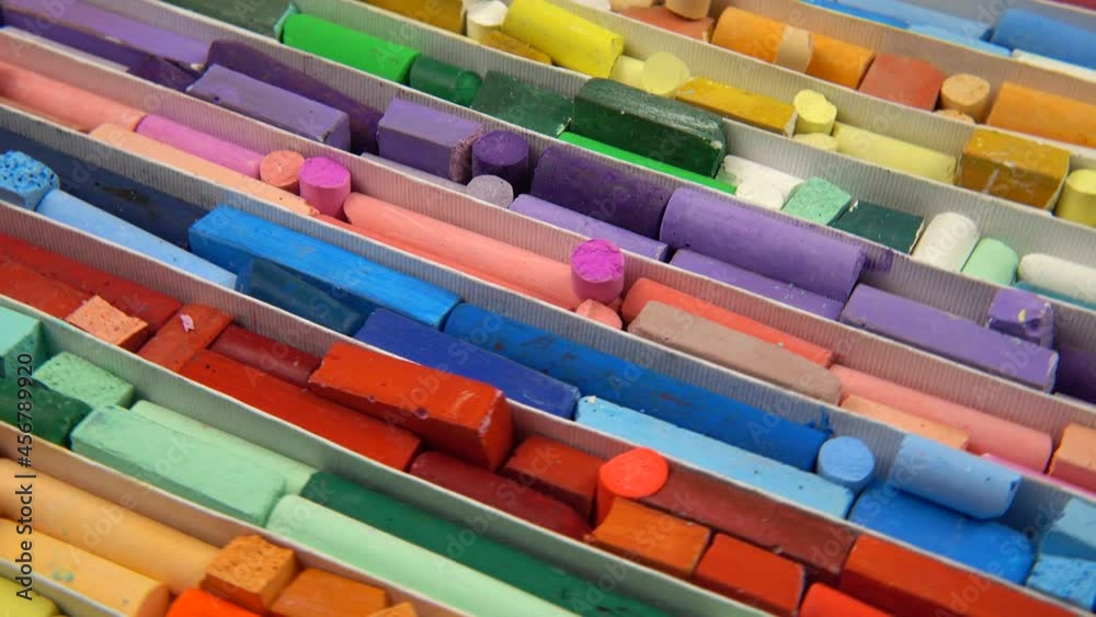 Multi-colored crayons of the various types, shapes and sizes lay out in ...