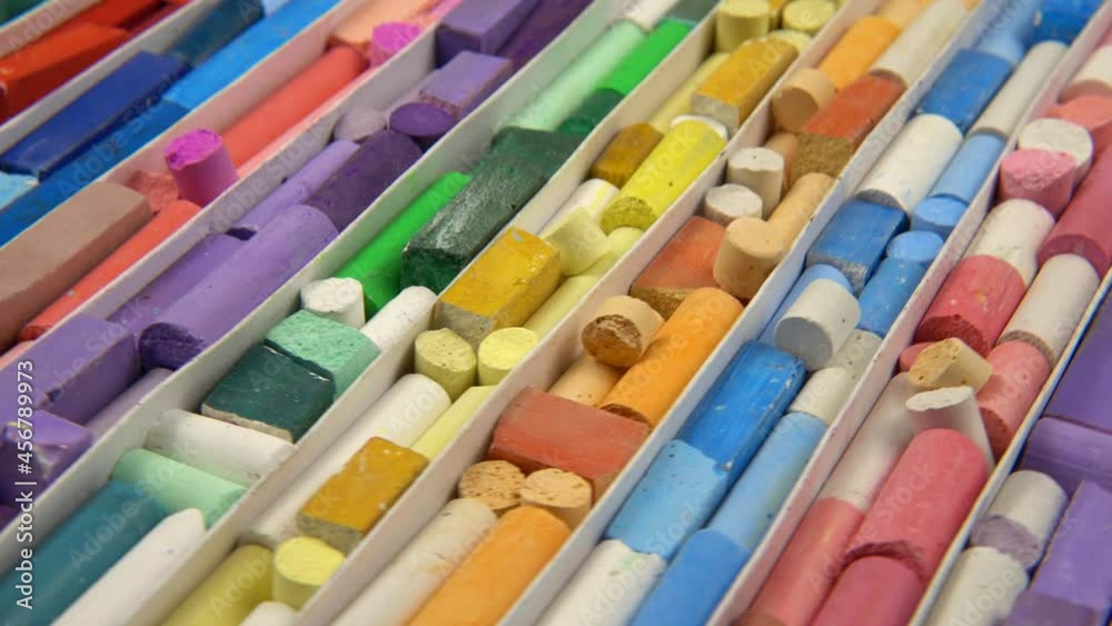 Multi-colored crayons of the various types, shapes and sizes lay out in ...