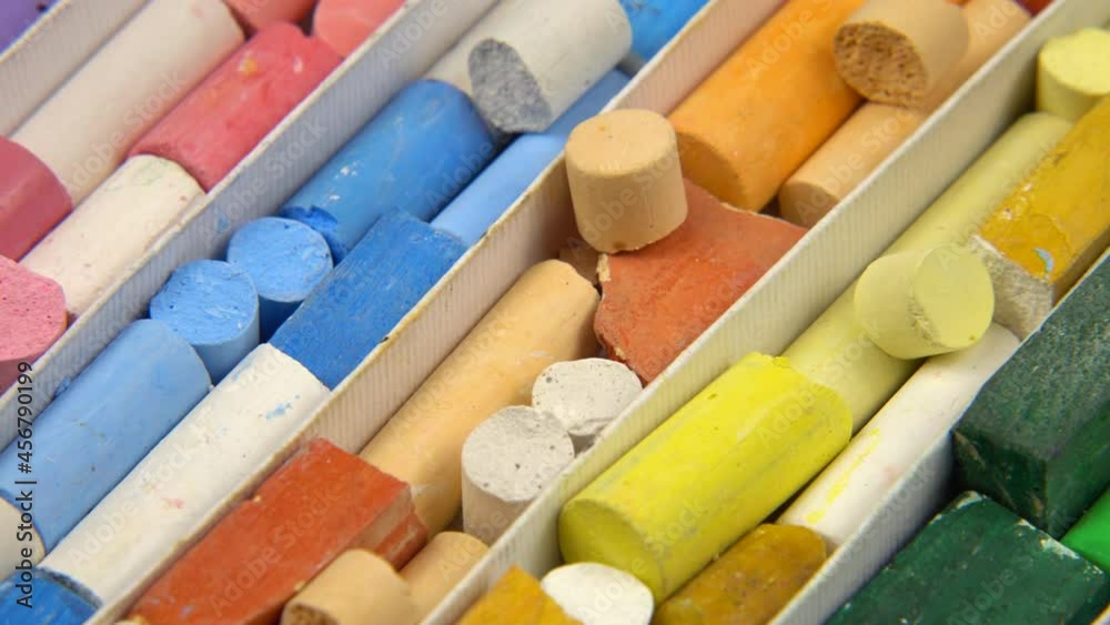 Multi-colored crayons of the various types, shapes and sizes lay out in ...