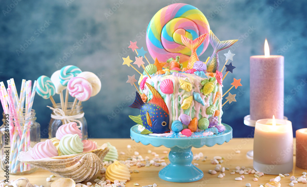 Mermaid theme candyland cake with colorful glitter tails, shells and ...