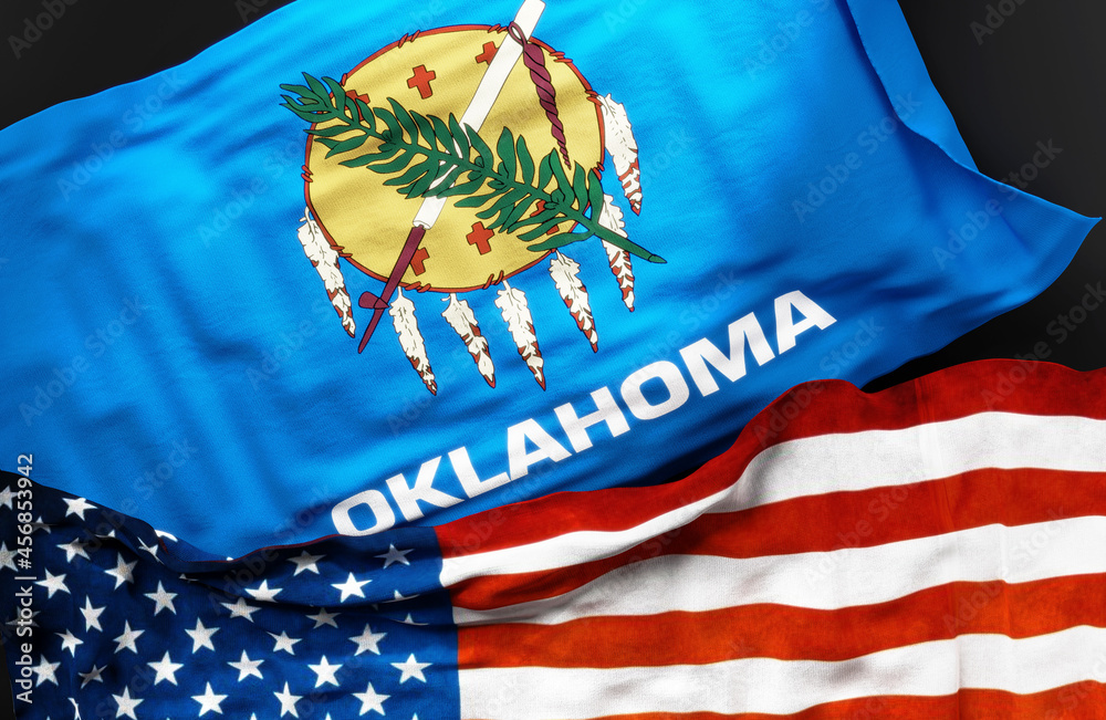 Flag of Oklahoma along with a flag of the United States of America as a ...