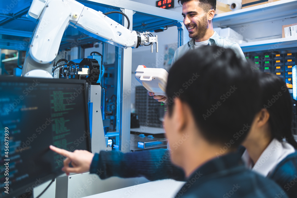 Meeting asian Engineers Maintenance Robot Arm at Lab. they are in a ...