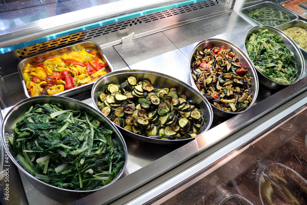 Typical Italian foods ready for purchase in an Italian take-away deli ...
