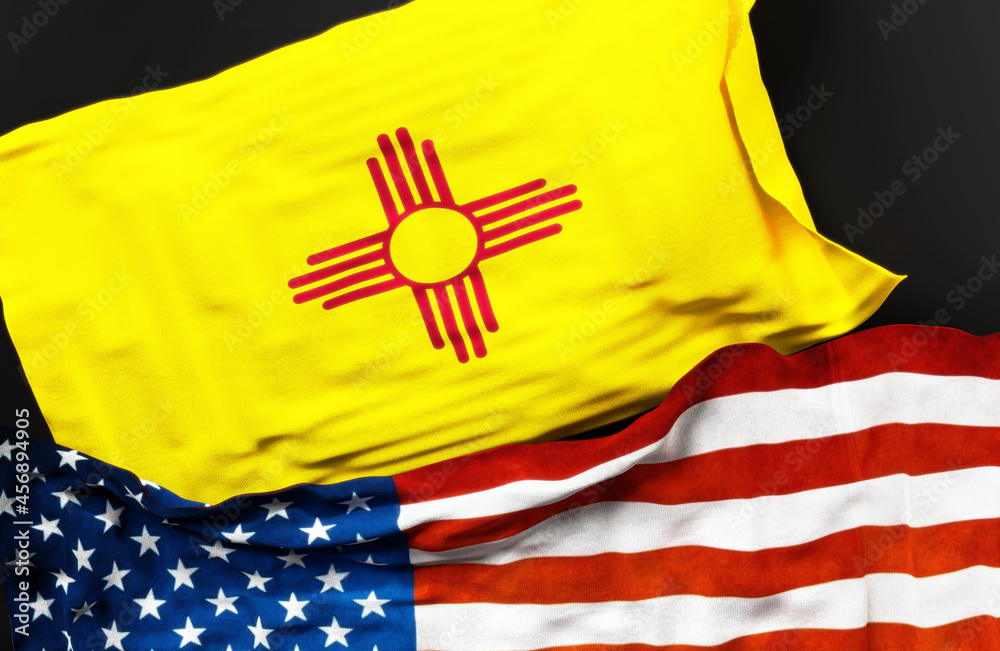 Flag of New Mexico along with a flag of the United States of America as ...