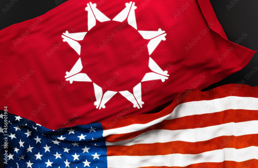 Flag of Pine Ridge along with a flag of the United States of America as ...