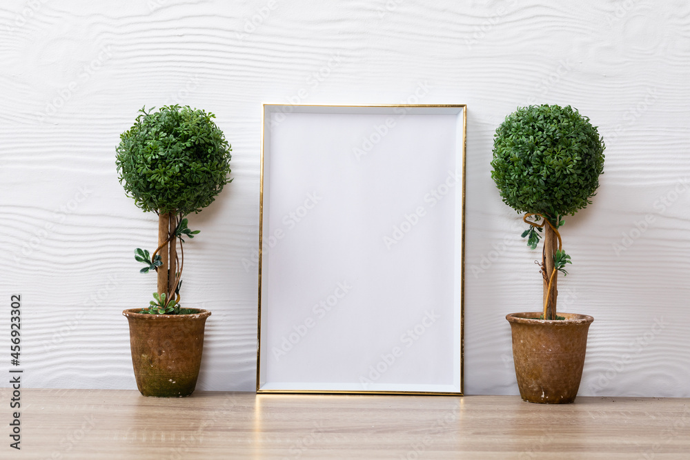 Composition of white card in frame with copy space and decorations on ...