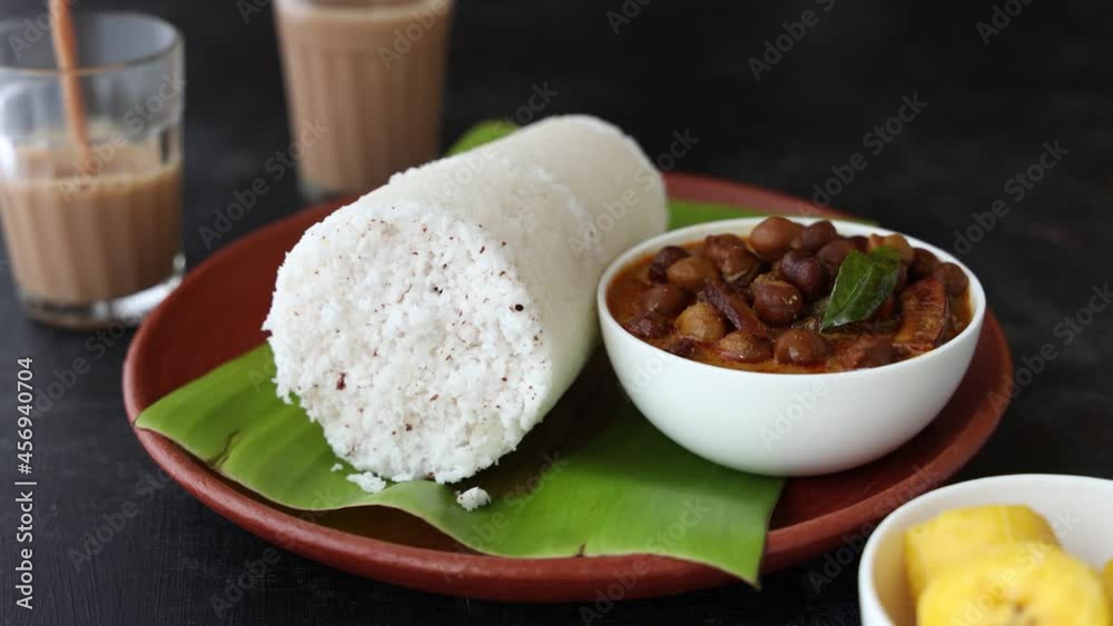 Pouring Indian milk tea with Rice Puttu white Pittu Kadala Chickpea ...