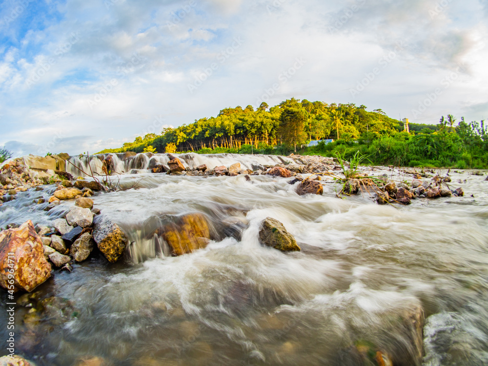 The river flows through a beautiful small dam. Small dams in rural ...