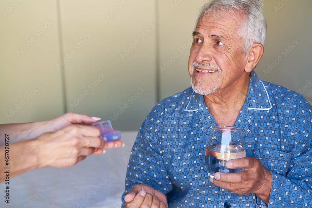 Smiling senior patient receives medication Stock Photo | Adobe Stock