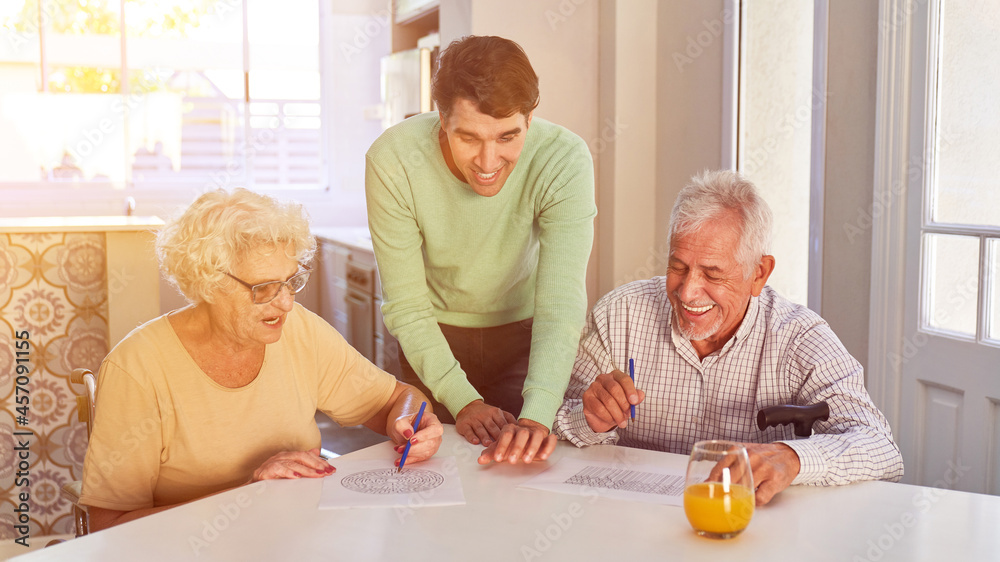 Seniors in family doing memory training with puzzles Stock Photo ...