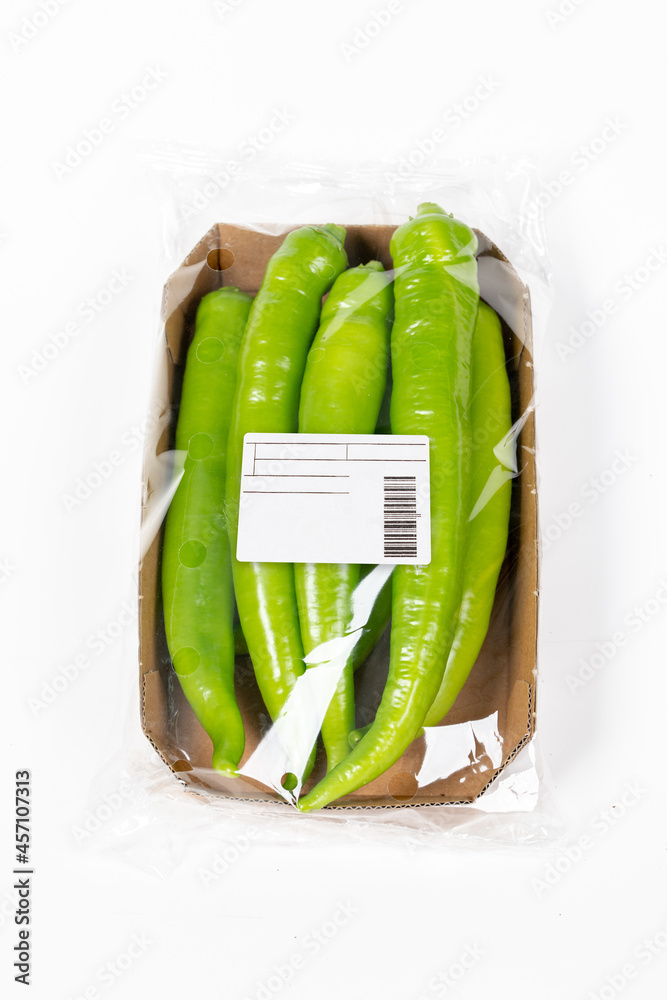 Green Mexican pepper packed and labeled on white background Stock Photo ...