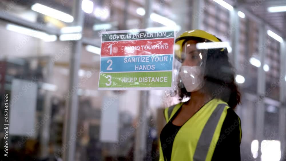 Video „woman factory worker holding the signage prevention of covid 19 ...