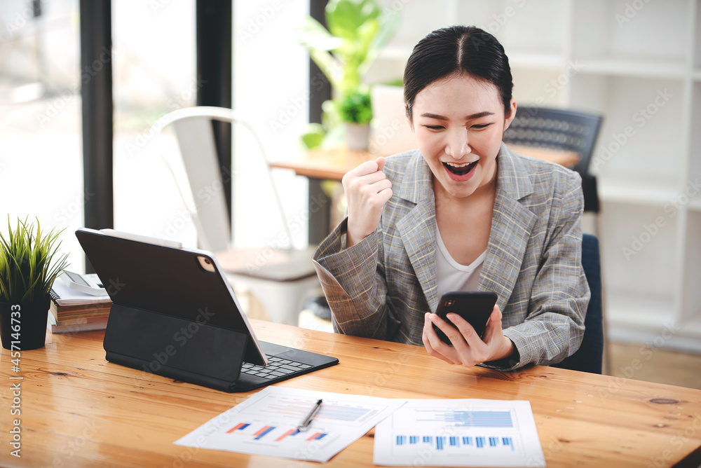 girl holding a credit card and using a laptop Business woman working ...