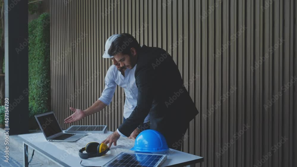 Team engineer talking and planning about install electric with panel of ...