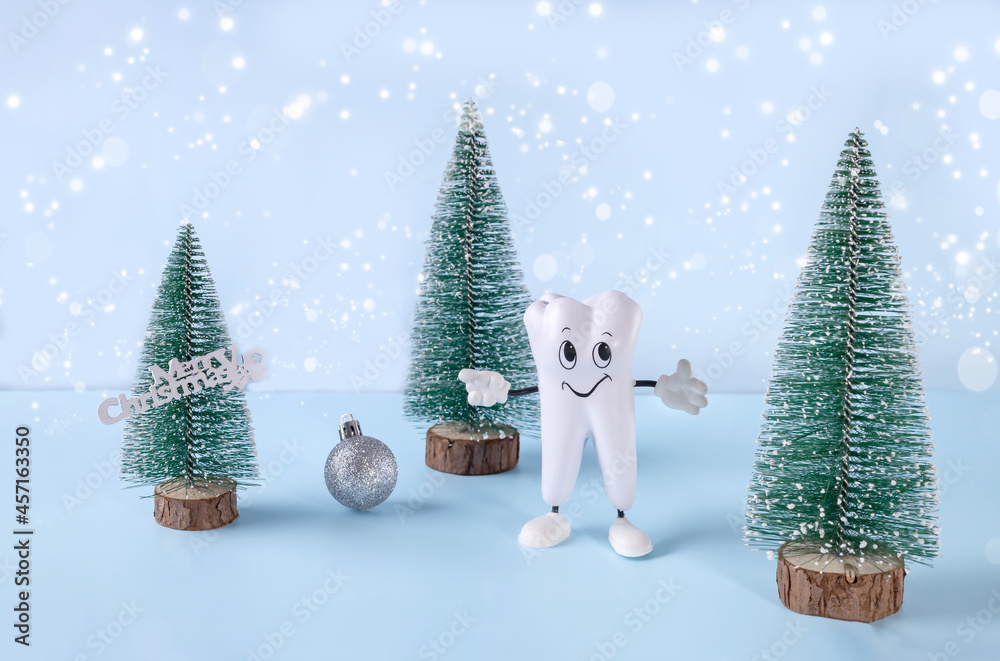 cartoon model of a tooth, Christmas trees with a ball and the ...