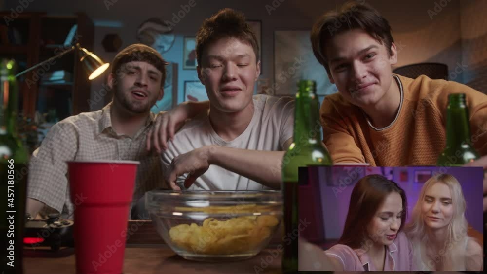Teenagers men speaking with women online, using video call, drink at ...