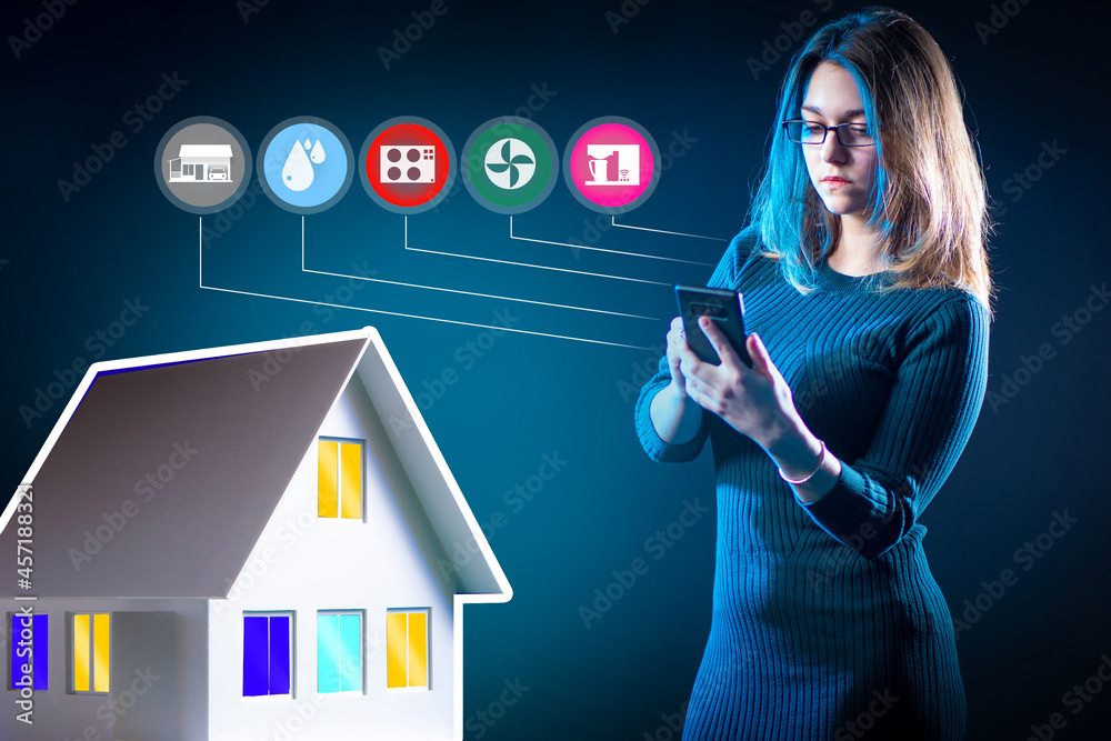 Woman controls smart home. Layout of a house next to a businesswoman ...